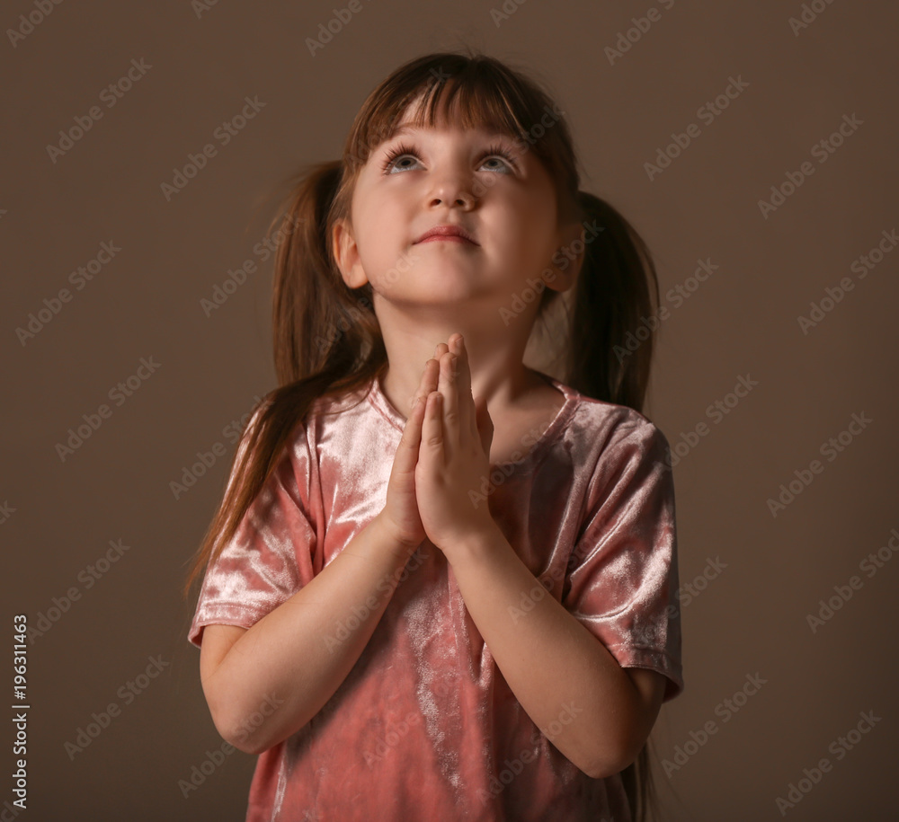 Religious Christian girl praying on dark background Stock Photo | Adobe ...