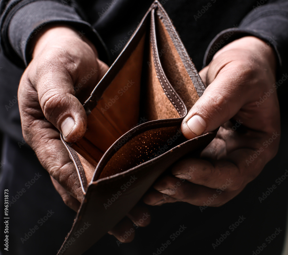 Poor man showing his empty wallet, closeup Stock-Foto | Adobe Stock