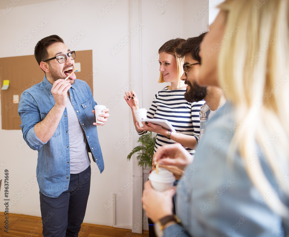 Group of young playful happy coworkers having fun on break while ...
