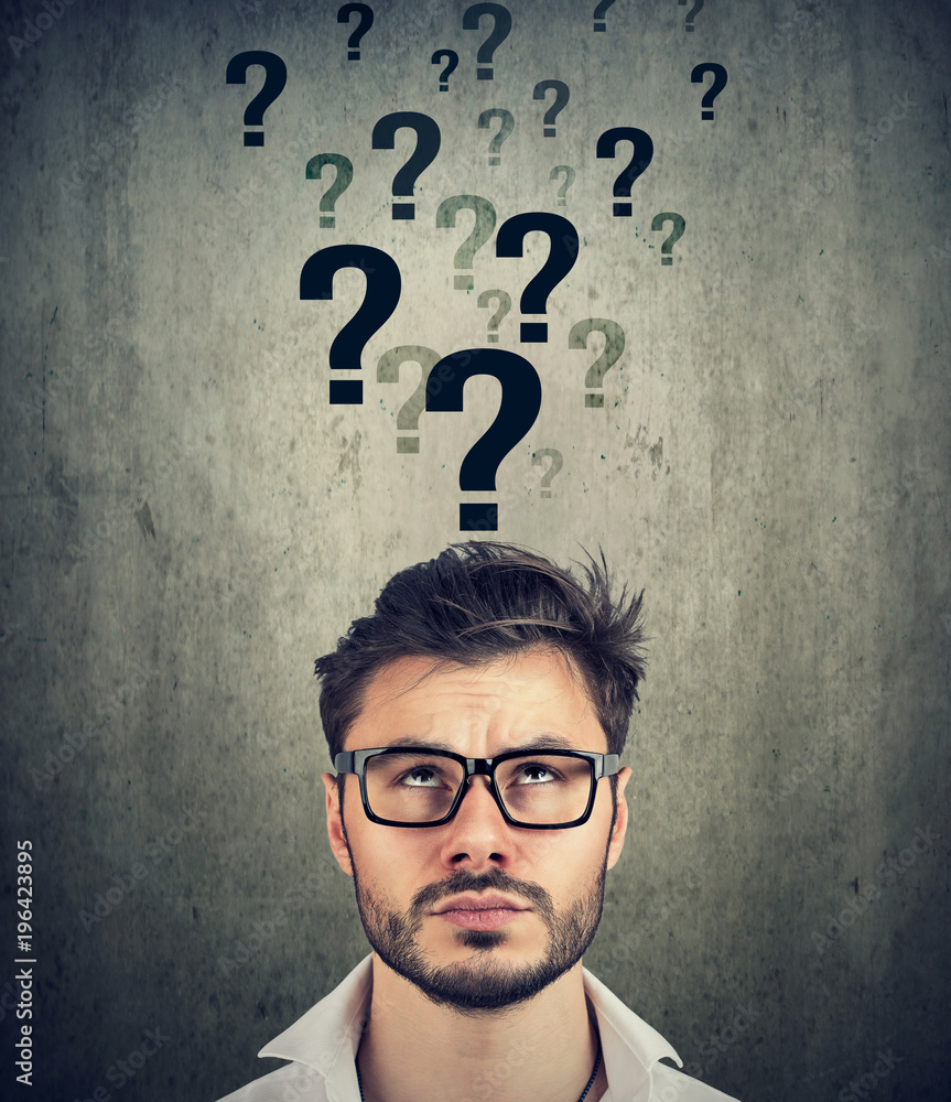 Man with too many questions and no answer Stock Photo | Adobe Stock