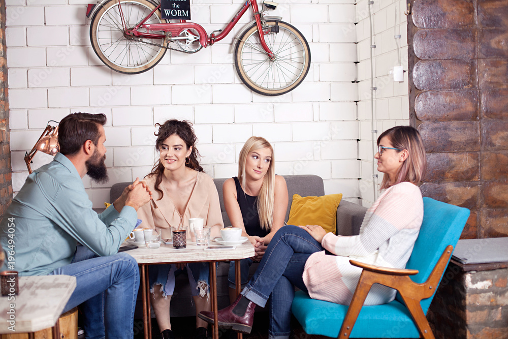 People Drinking Coffee In A Cafe
