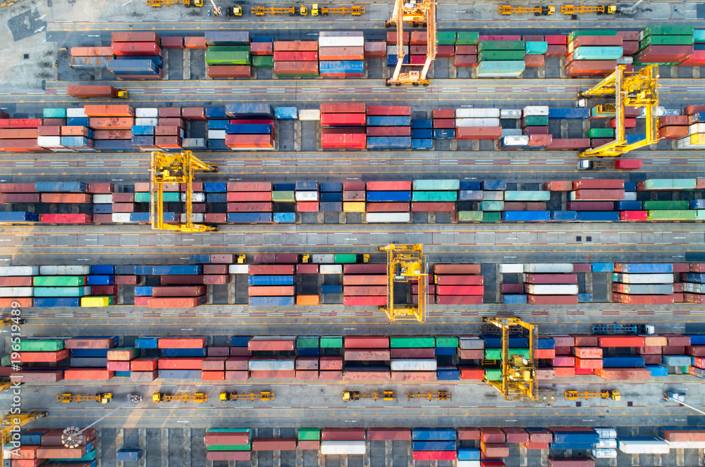 Foto de Containers yard in port congestion with ship vessels are ...