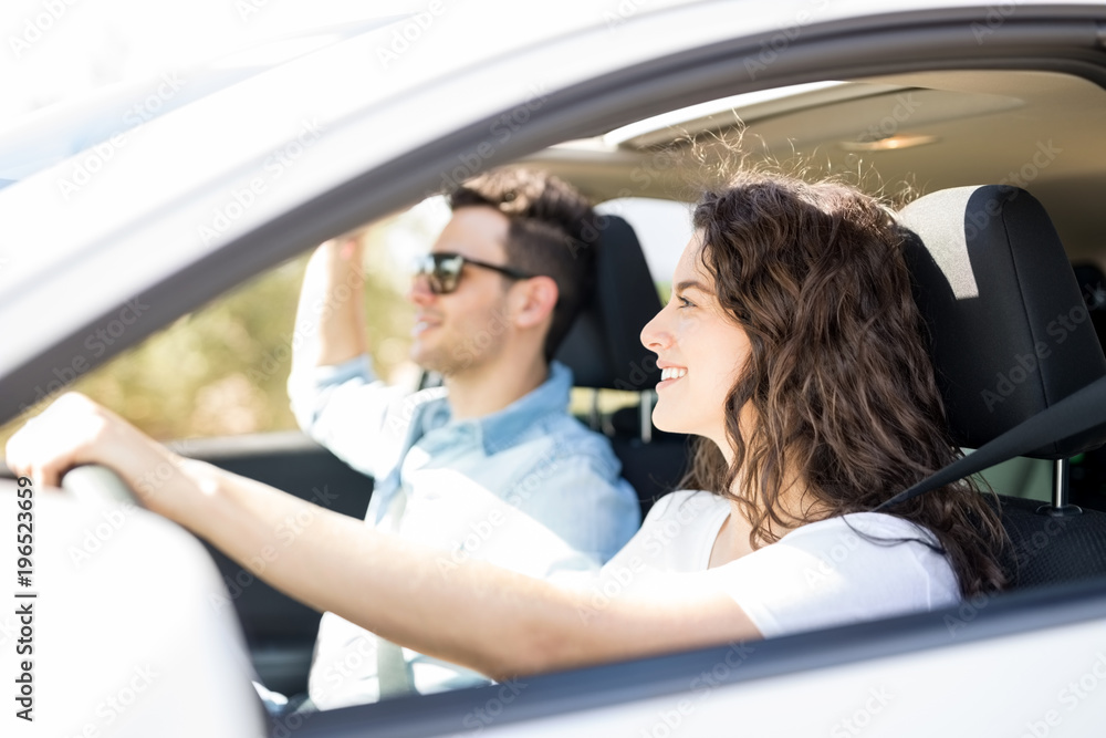 Girlfriend driving a car with boyfriend Stock Photo | Adobe Stock