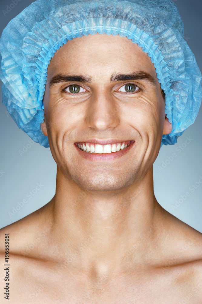 Happy man patient in medical hat ready for operation. Portrait of Man ...