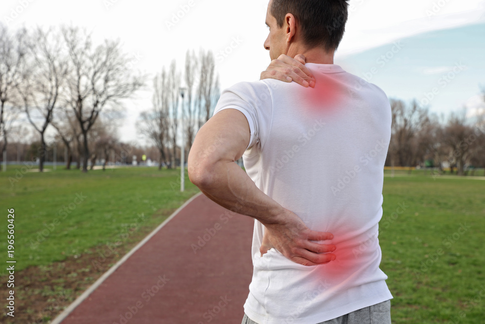 Sport injury, Man with back pain. Pain relief and health care concept ...