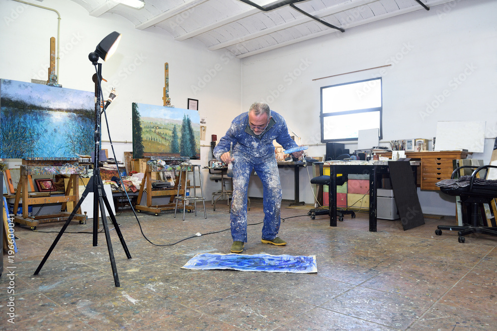 portrait of a painter artist who works in his studio Stock Photo ...