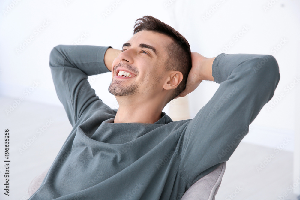 Young man resting in armchair. Joy of life Stock Photo | Adobe Stock