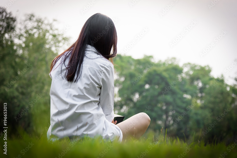 Girl Sitting Alone In Garden