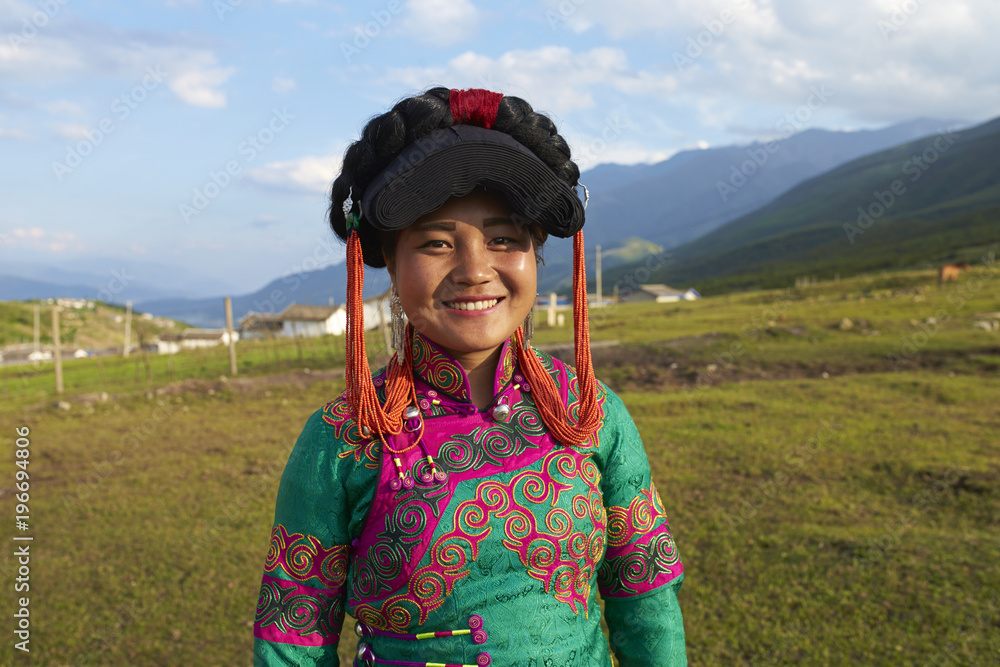 Beautiful Chinese Yi people in traditional costumes outdoor Stock Photo ...