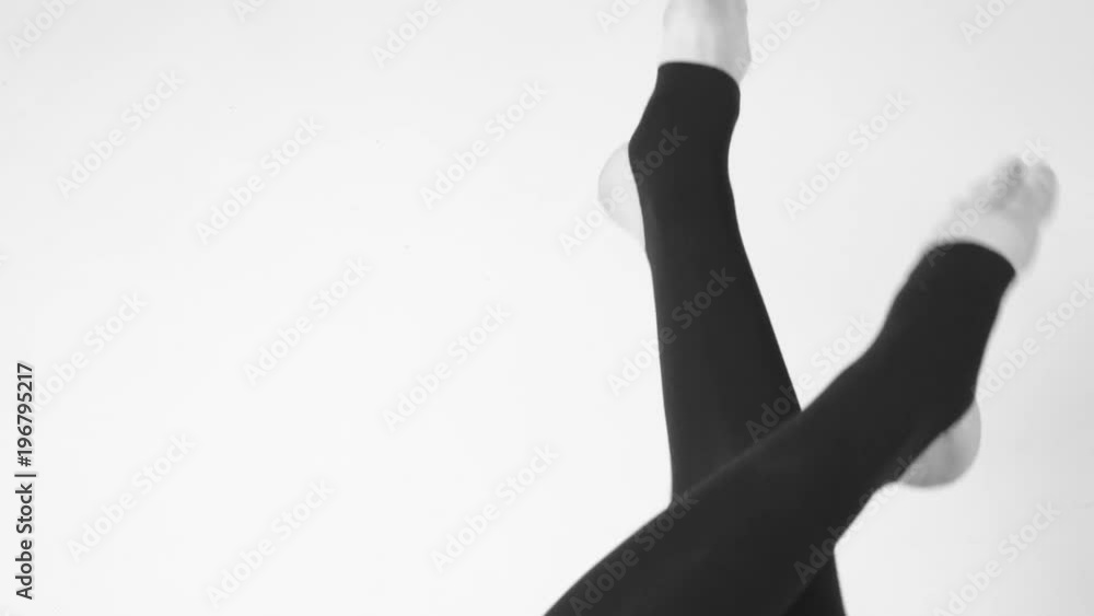 Black and white image. Young woman choreographer dancing in a black ...