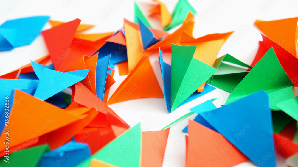 the multi-colored leaflets which are cut out from paper, colourful ...