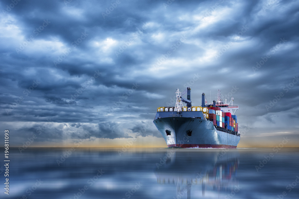 cargo container ship running in the ocean between storm cloud concept ...