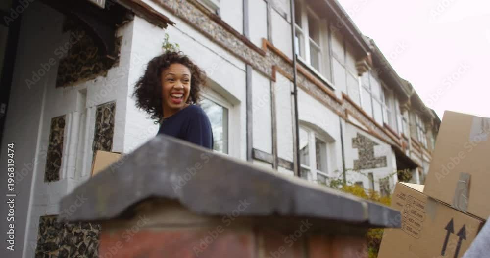 4K Young mixed race couple moving in to new home & man carrying a big ...