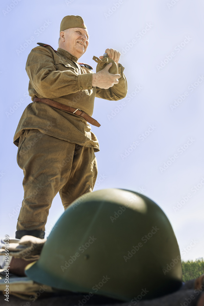 Soviet soldier flask of water in uniform of the World war 2 period ...