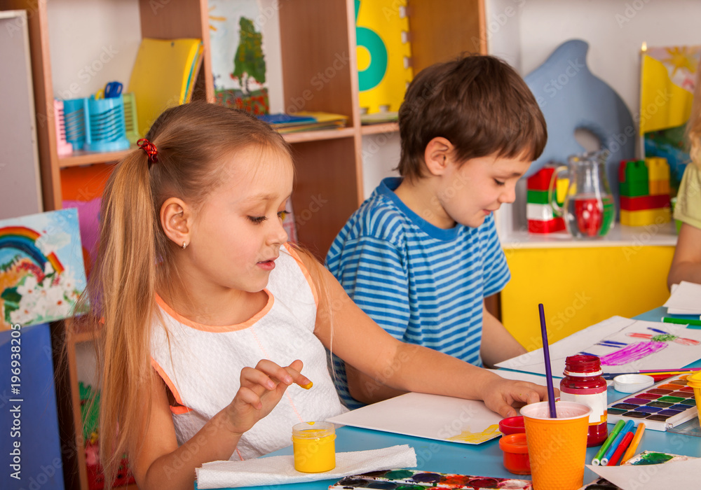 Small students girl and boy painting in art school class. Child drawing ...
