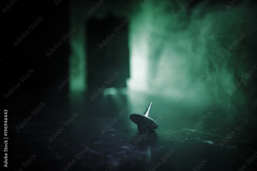 Totem spinning top spinning, wobbling and stopping. Spinning top on ...