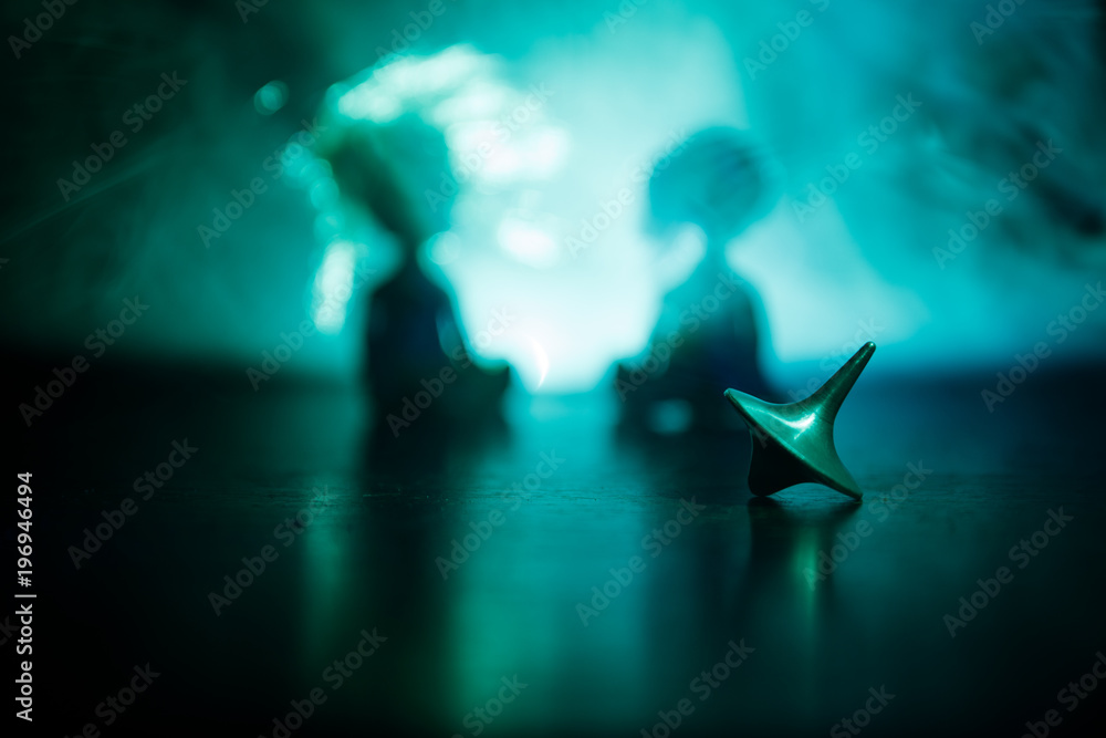 Totem spinning top spinning, wobbling and stopping. Spinning top on ...