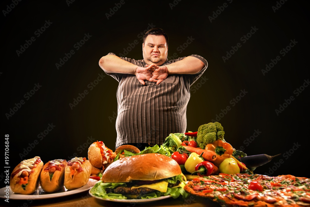 Diet fat man who makes choice between healthy and unhealthy food ...