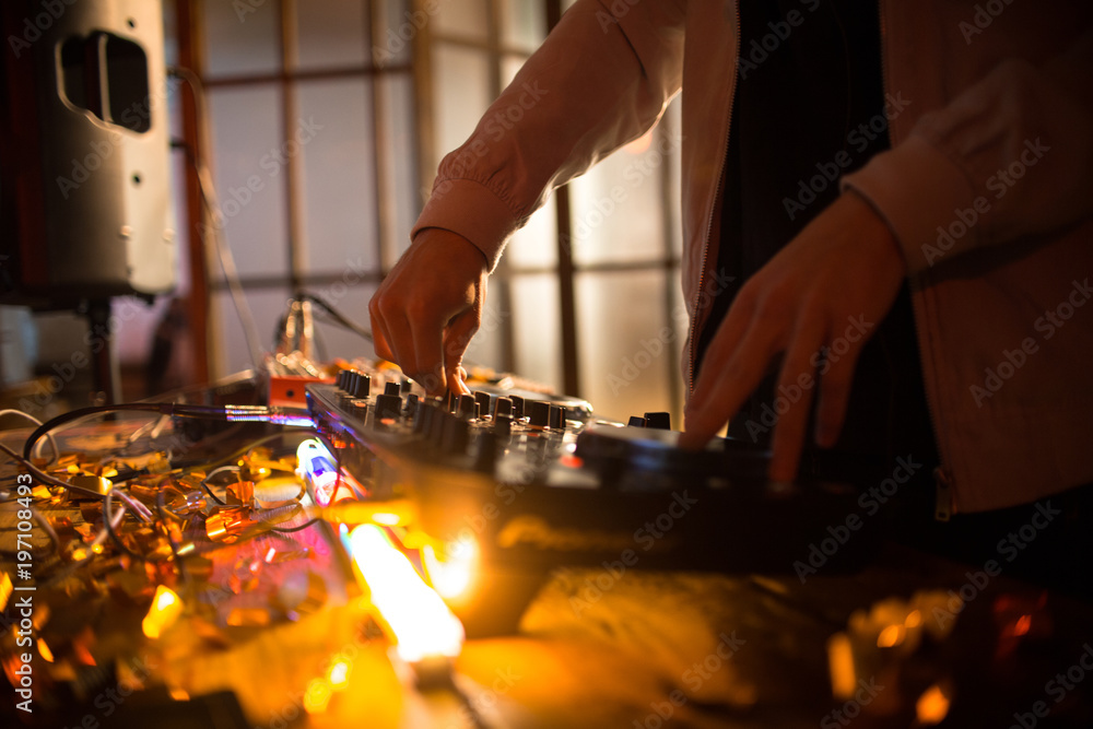 Close-up shot of unrecognizable DJ mixing music with professional ...