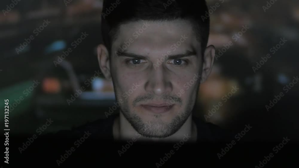 Close up of Young man plays in video game street racing simulator with ...