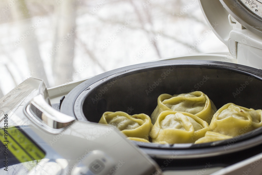 Uzbek mantas cooked in a double boiler, front and back are blurred ...