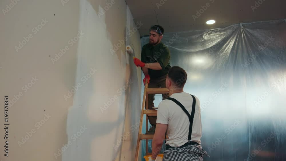 The maintenance personnel actively fulfilling the complete repair. One ...