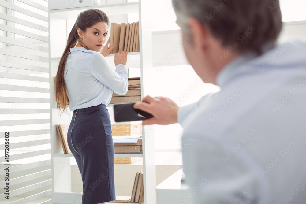 Uncomfortable situation. Unhappy cheerless young woman standing near ...