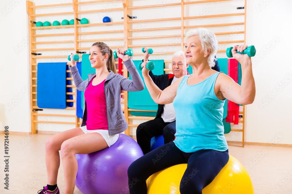 Group of senior and young people at physiotherapy doing exercises Stock ...