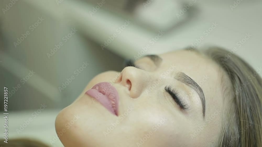 Microblading procedure. Master marks out customer's eyebrows. Stock ...