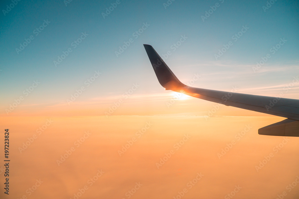 aircraft wing with sunset sky,scenic outside windows,sunnet in the air ...