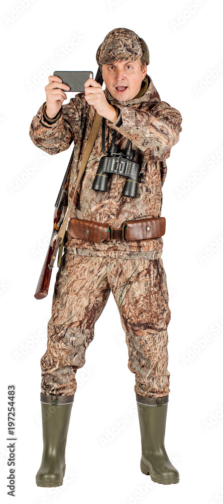 Full length portrait of a male hunter with double barreled shotgun ...