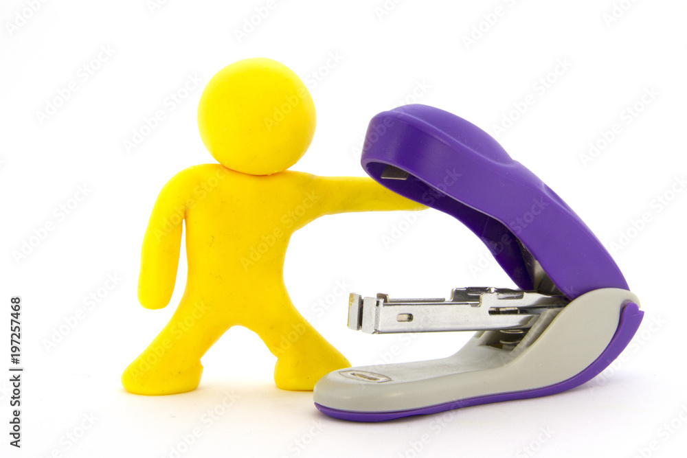Yellow plasticine characters and stapler. Stationery. Isolated on white ...