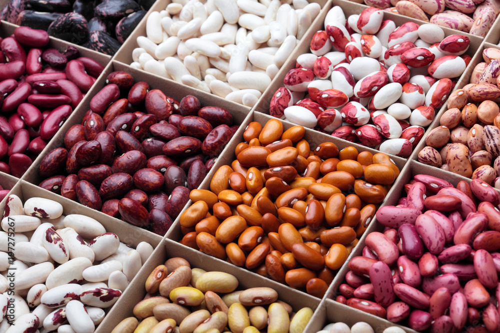 Different types of legumes beans. In wooden box.Varieties of beans ...