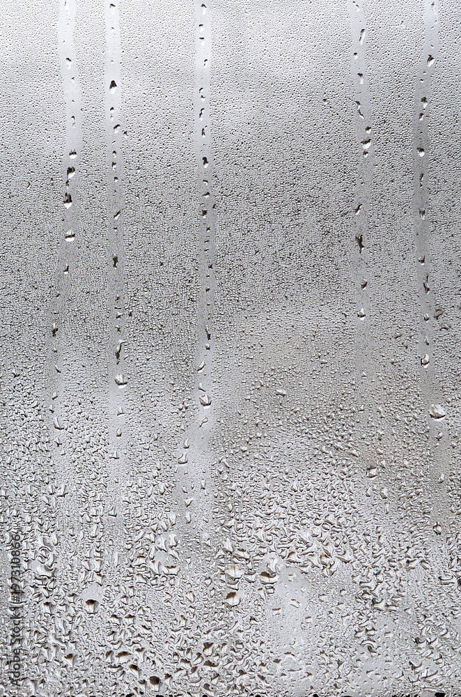 Texture of a drop of rain on a glass wet transparent background. Toned ...