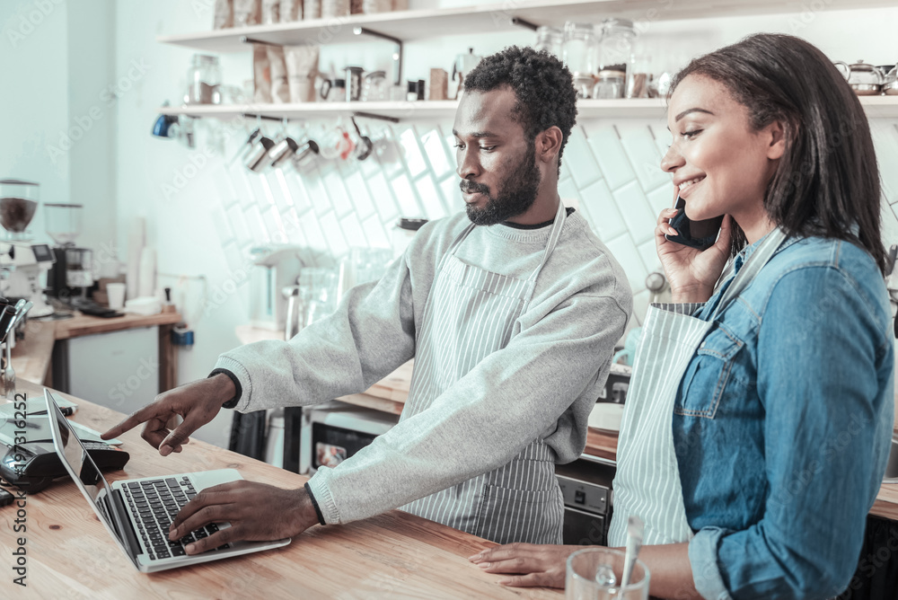 Professional staff. Handsome nice positive man standing together with ...