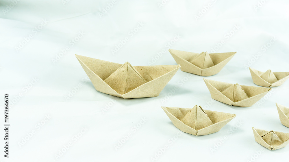 paper boat brown color on white background Stock Photo | Adobe Stock