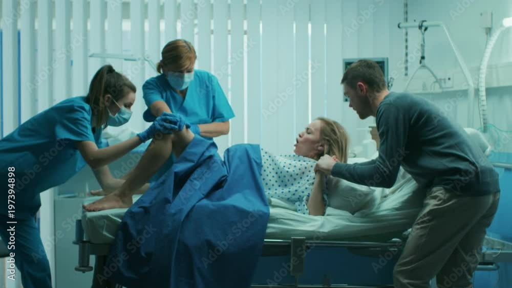 In the Hospital Woman in Labor Pushes to Give Birth, Obstetricians ...