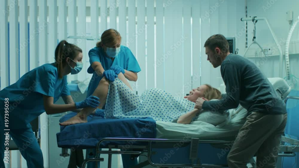 In the Hospital Woman in Labor Pushes to Give Birth, Obstetricians ...