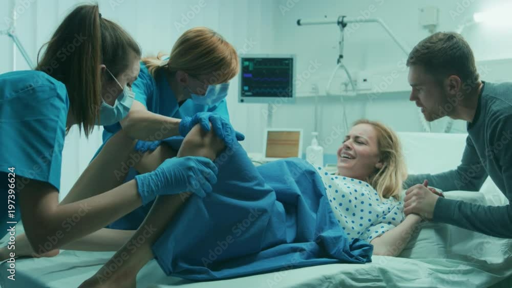 In the Hospital Woman in Labor Pushes to Give Birth, Obstetricians ...