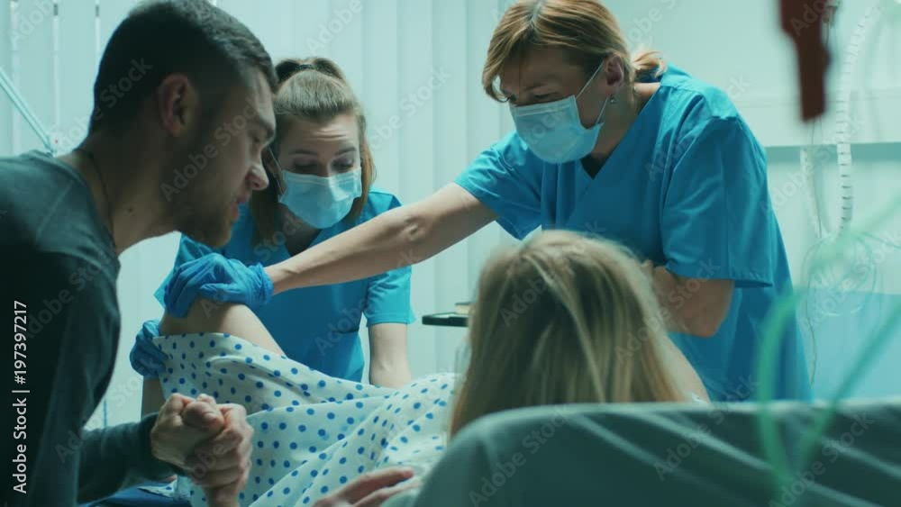 In the Hospital Woman in Labor Pushes to Give Birth, Obstetricians ...