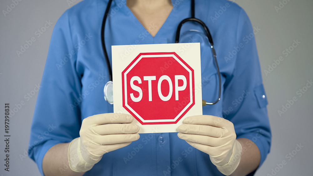 Stop sign in female physician hands, doctor warning about diseases ...