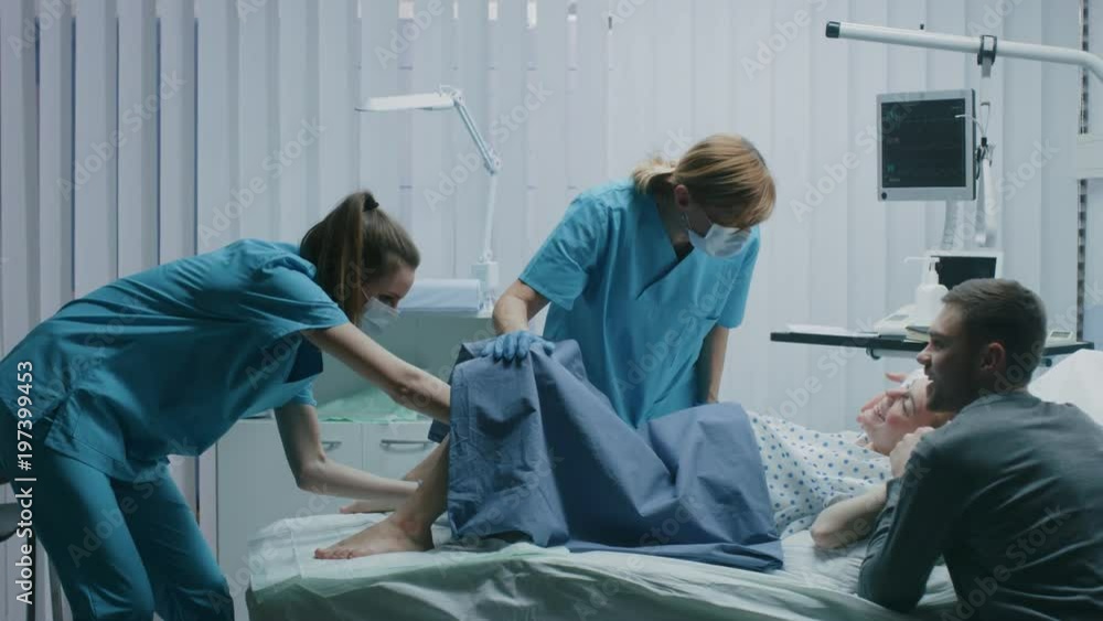 In the Hospital Woman in Labor Pushes to Give Birth, Baby Comes out ...