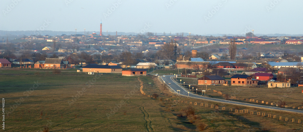 The village in the Chechen Republic, lit by rays of sunset. Stock Photo ...