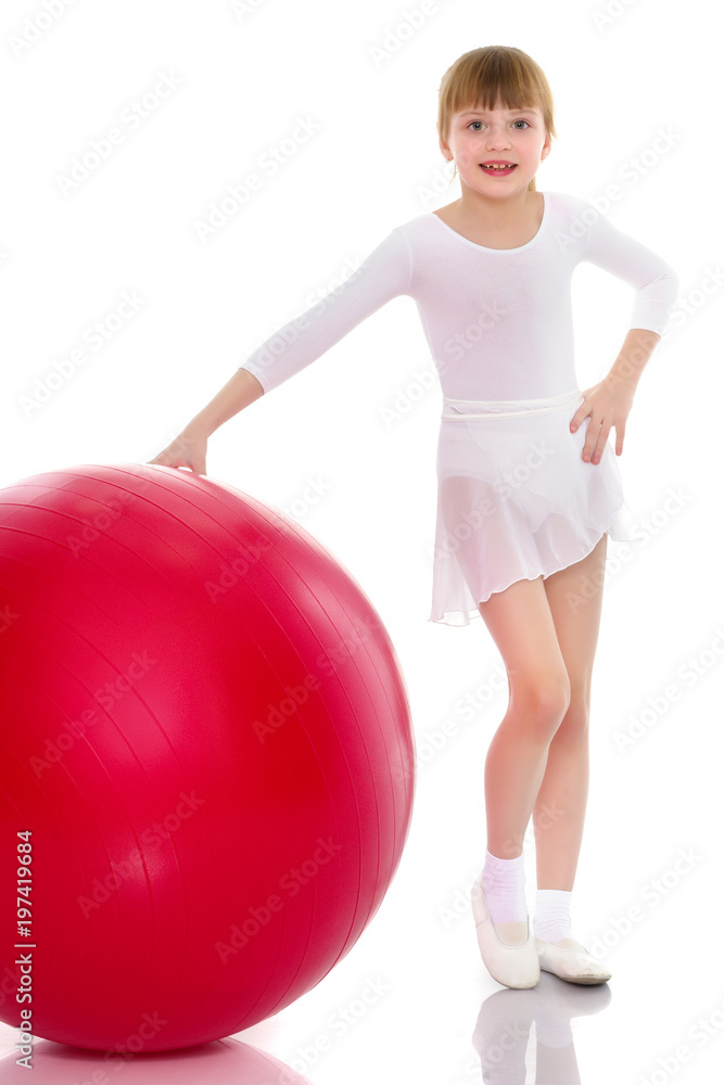 little girl doing exercises on a big ball for fitness. Stock Photo ...