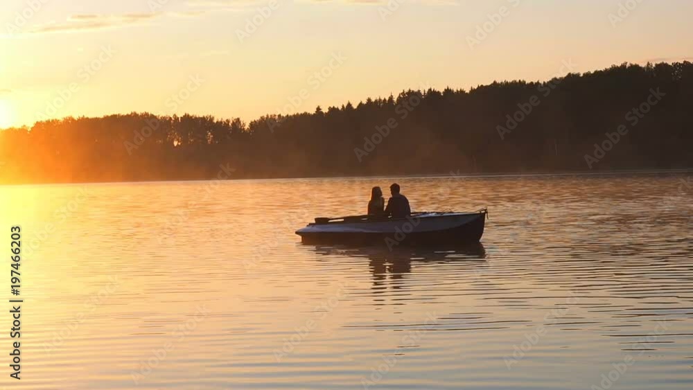 Romantic golden sunset river lake fog loving couple small rowing boat ...