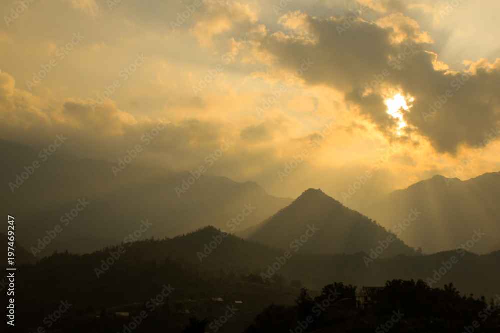 sun ray and sun light shining through clouds hitting layers of ...