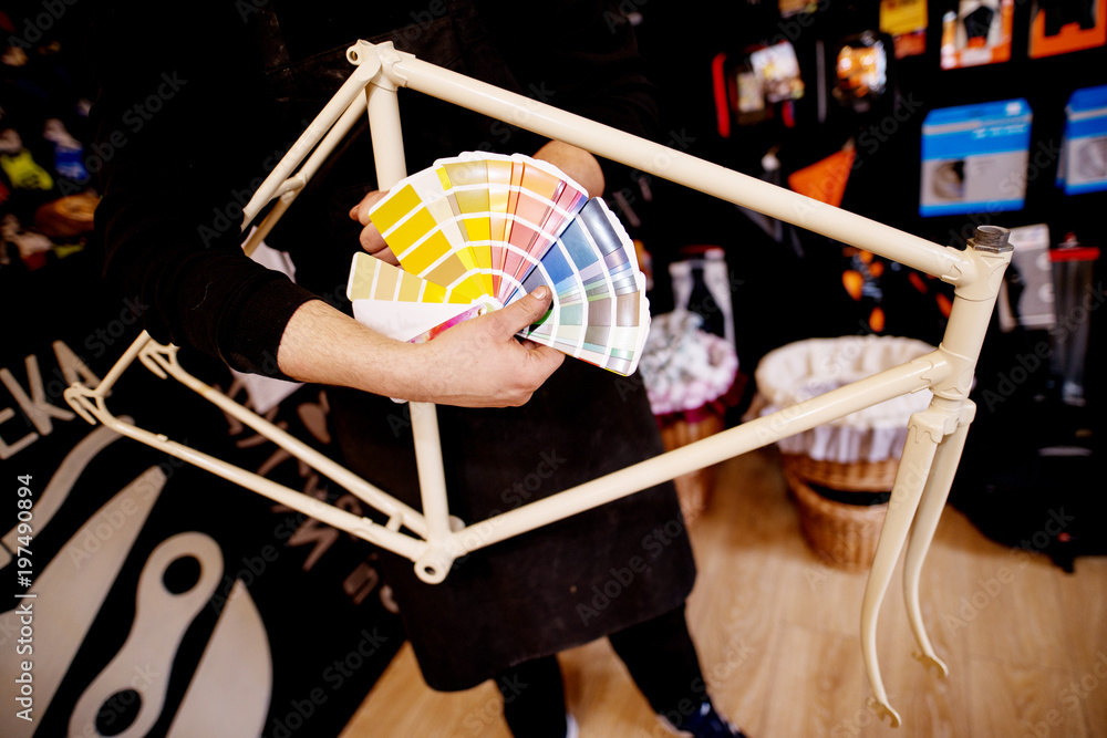 Choosing a color for a bicycle in the workshop from the color palette ...