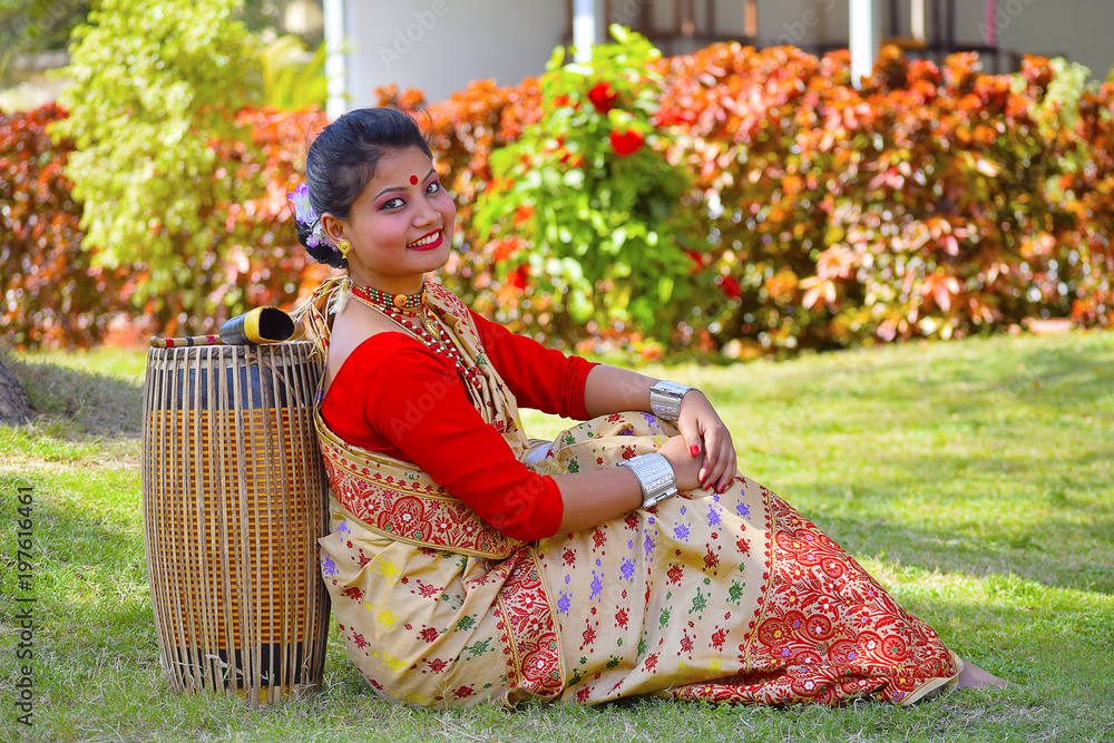 Assamese girl In traditional attire posing with A Dhol, Pune ...