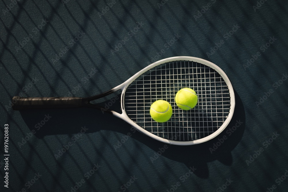 Tennis ball and racket in tennis court Stock Photo | Adobe Stock