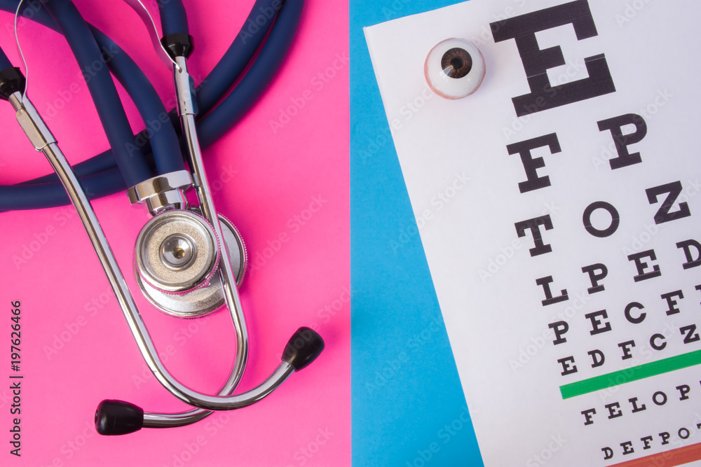 Table for visual acuity test (Snellen chart) and medical stethoscope is ...